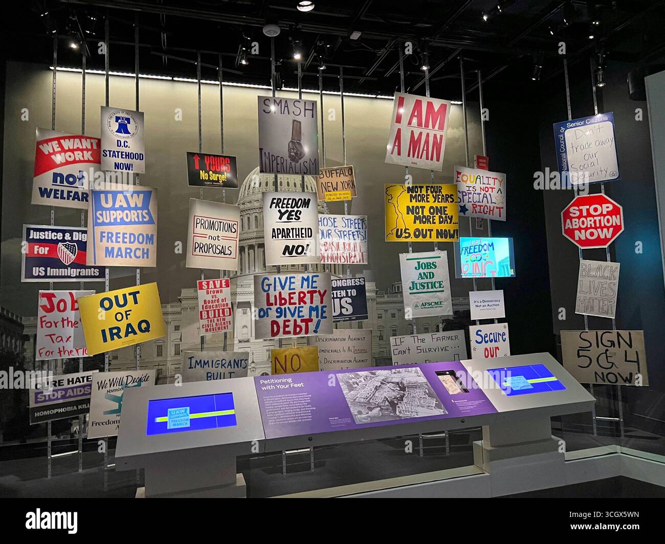Protest signs from a selection of historic demonstrations are displayed ...