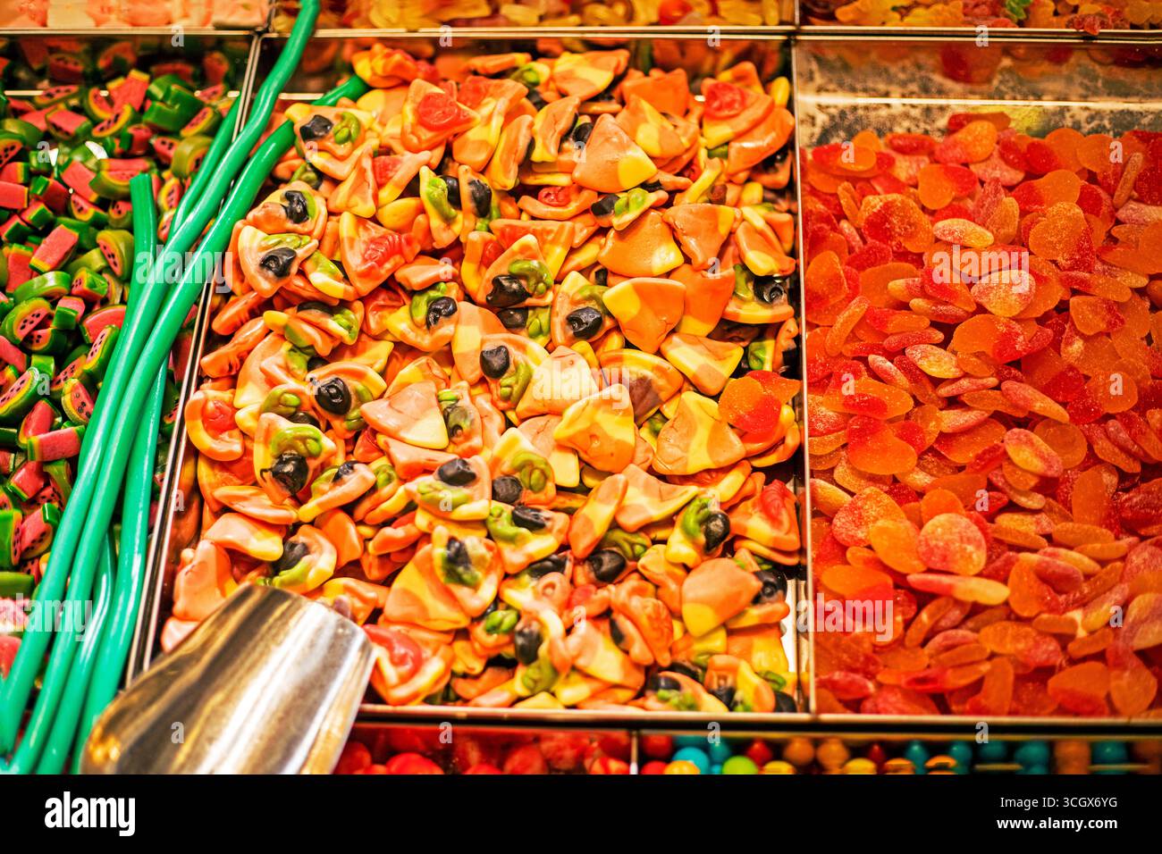 jelly candies and marmalades of different flavors and shapes by weight ...