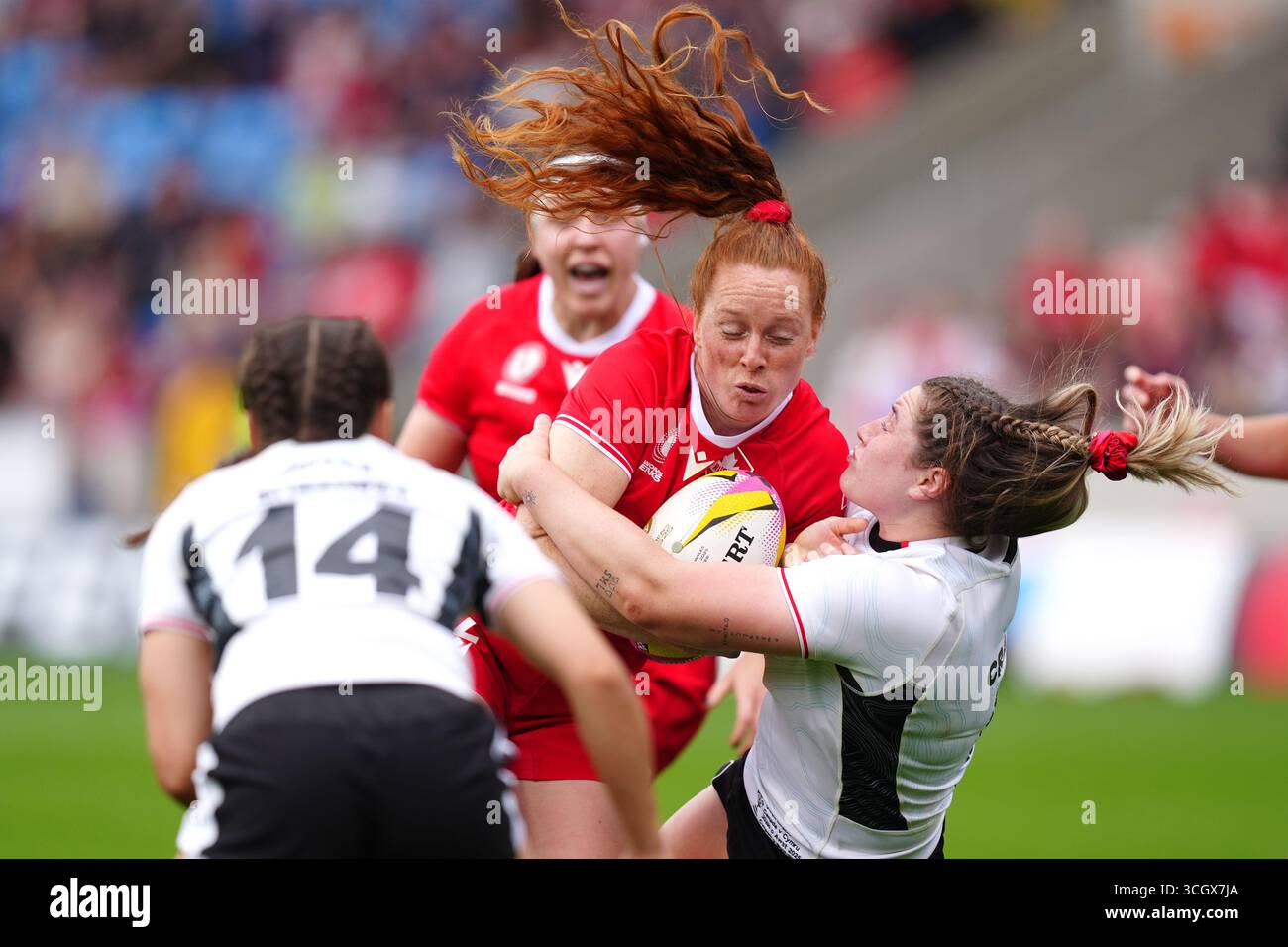 Canada's Alex Tessier is tackled by Wales' Courtney Keight during the ...