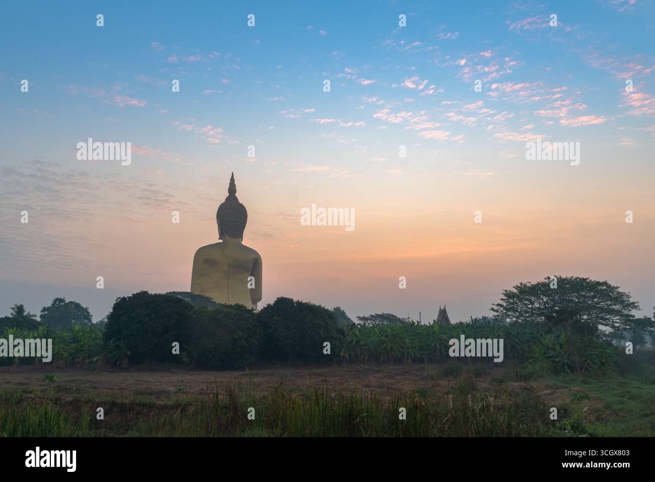 scenery sunrise in front of the great Buddha of Thailand at wat Muang ...