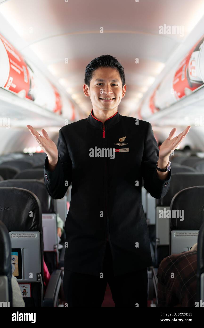 Sepang, Malaysia - July 29, 2024: male AirAsia cabin crew member in ...