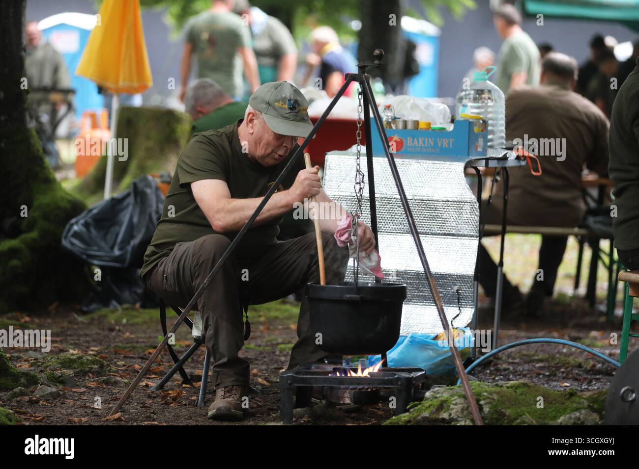 A man cooks a hunting stew in a cauldron at the 4th edition of Rika ...