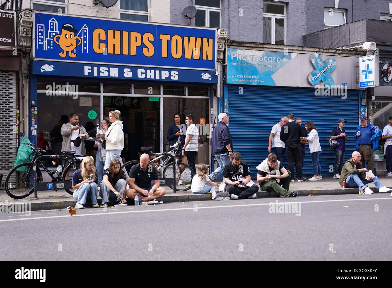 London, UK. 30th Aug, 2025. Tottenham Hotspur fans sat outside Chips ...