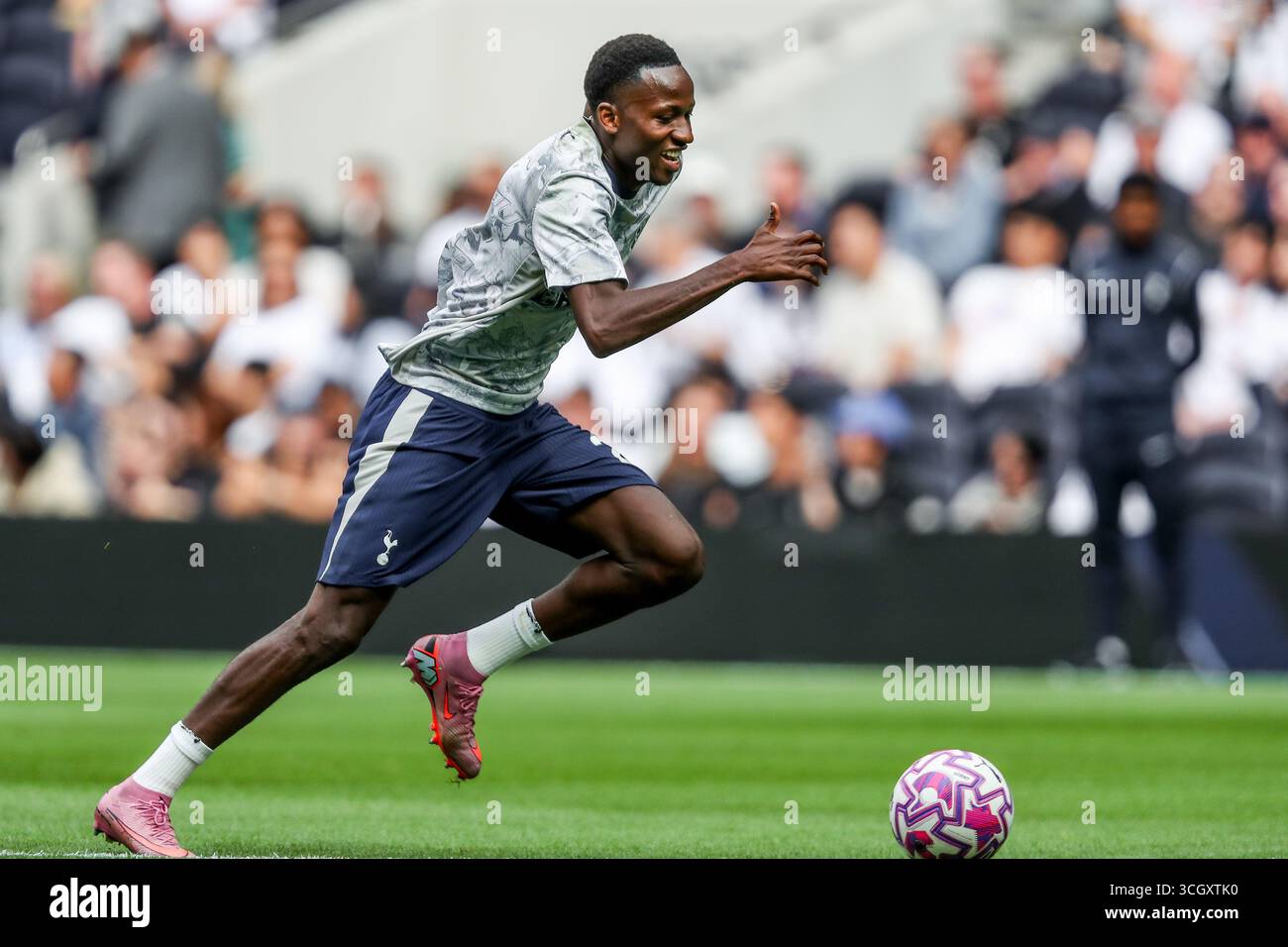 Pape Matar Sarr of Tottenham Hotspur warms up prior to the Premier ...