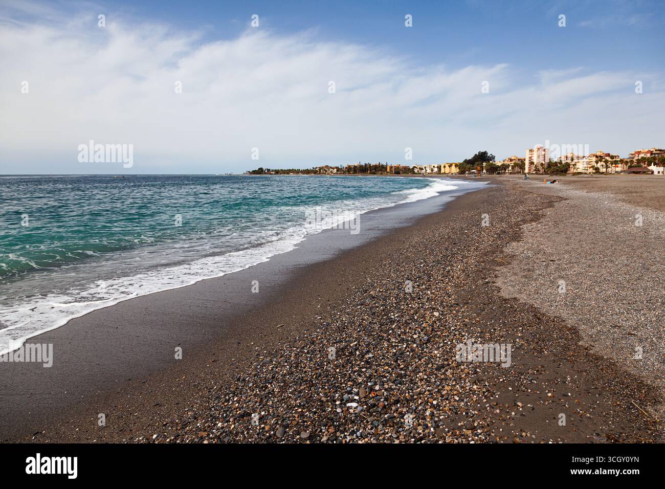 Spanish sea beach in the town of Motril with clear water and a small ...