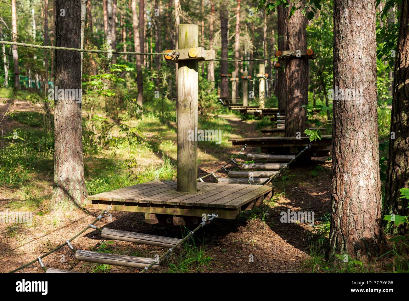 Wooden platforms connect via ropes, creating an engaging climbing ...