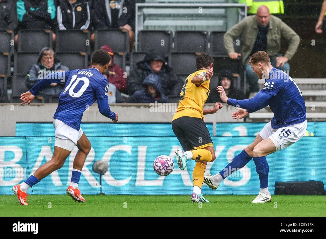 Everton's Jake O'Brien ( right) hits the ball to safety during the ...