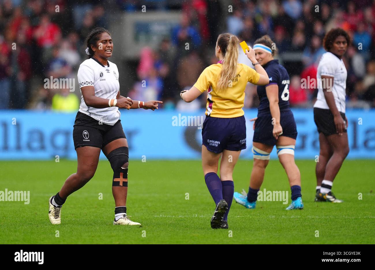 Fiji's Bitila Tawake (left) is shown a yellow card by referee Lauren ...