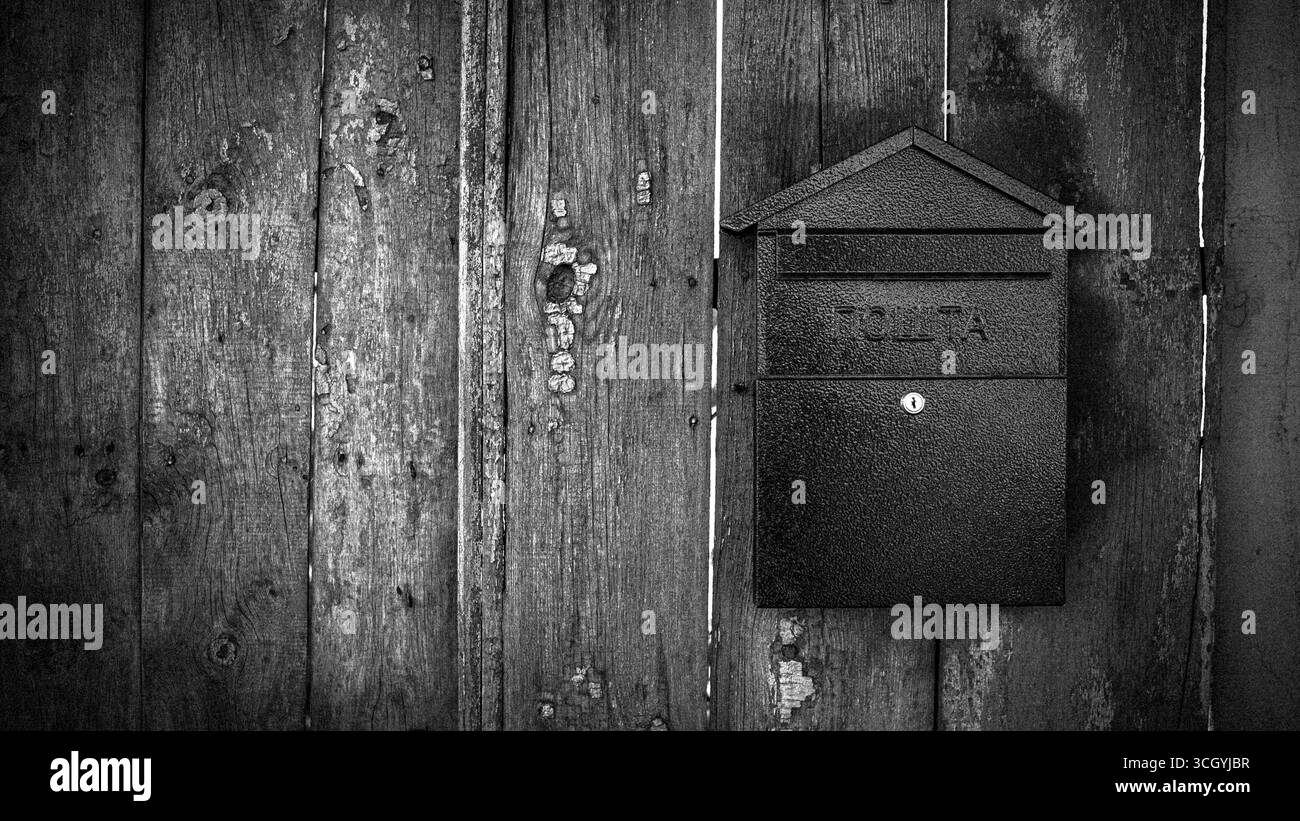 Old mailbox on fence Black and White Stock Photos & Images - Alamy