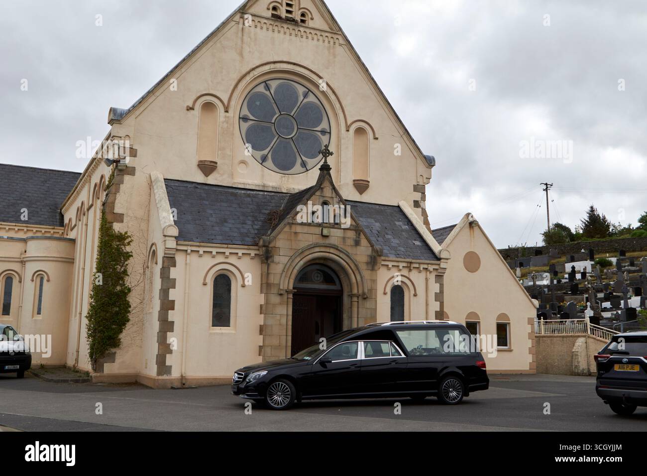 mercedes hearse from mccabe funeral directors outside the church of the ...