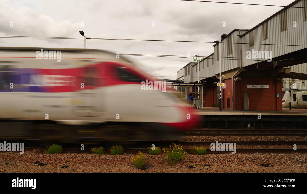 A LNER Azuma train speeds through Peterborough en route to London Kings ...