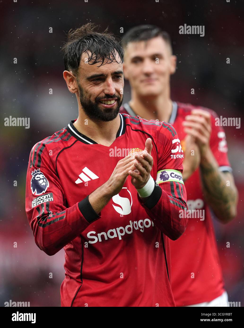 Manchester United's Bruno Fernandes applauds the fans after the full ...