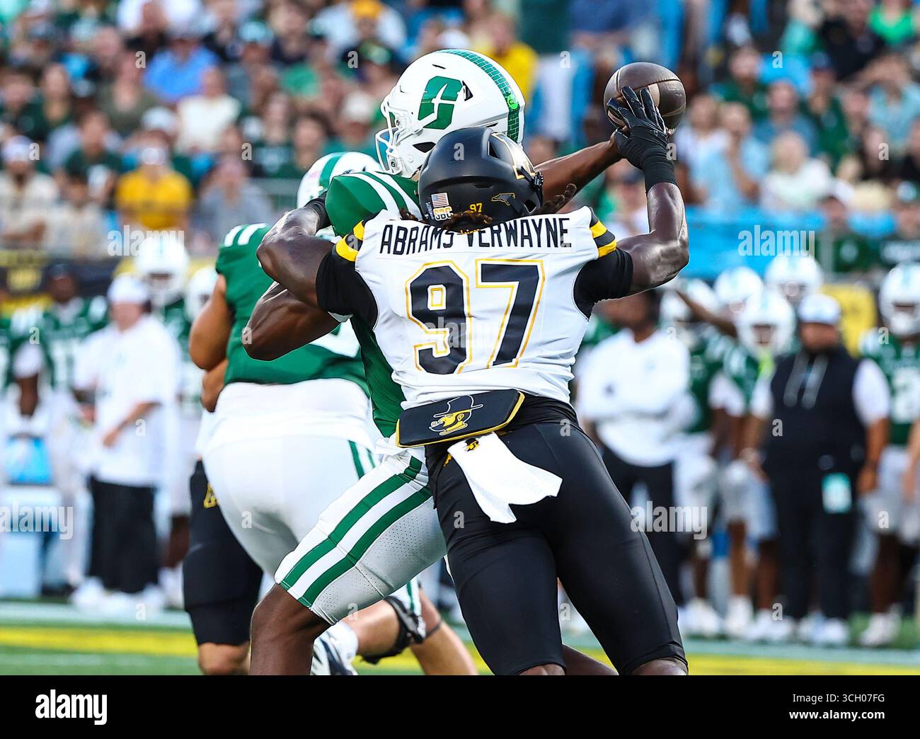 August 29, 2025: UNC-Charlotte defensive lineman Jalar Holley (97) bats ...