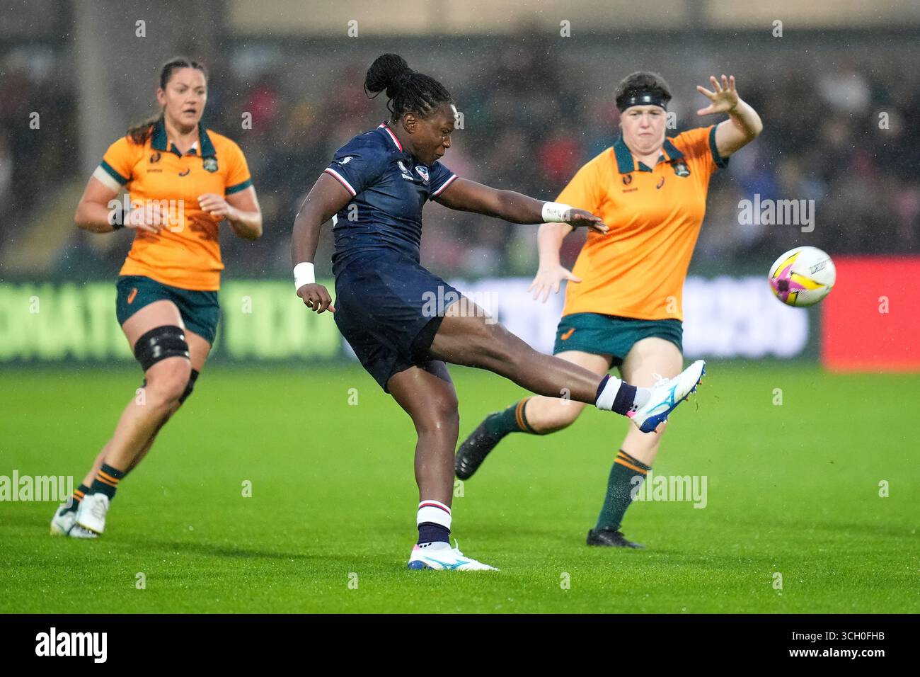 USA's Cheta Emba (centre) kicks the ball clear during the Women's Rugby ...