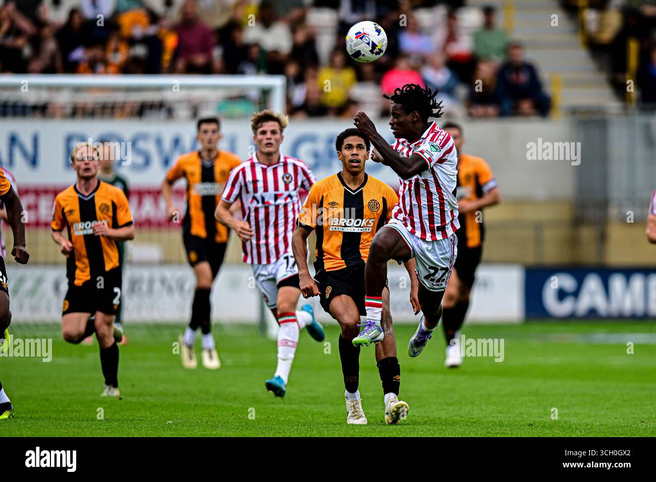 Habeeb Ogunneye (22 Newport County) heads the ball during the Sky Bet ...