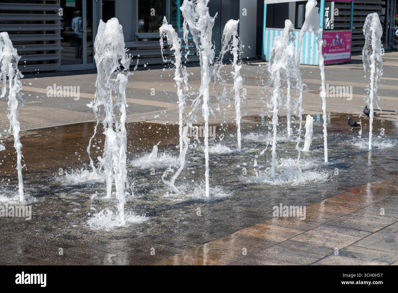 City fountain made from tiled pavement Stock Photo - Alamy