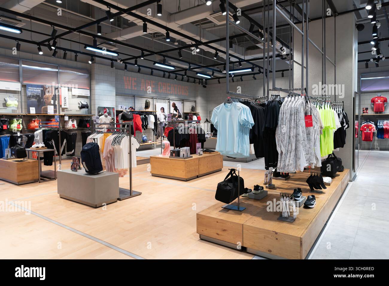 Kuala Lumpur, Malaysia - September 18, 2024: various clothing on racks ...