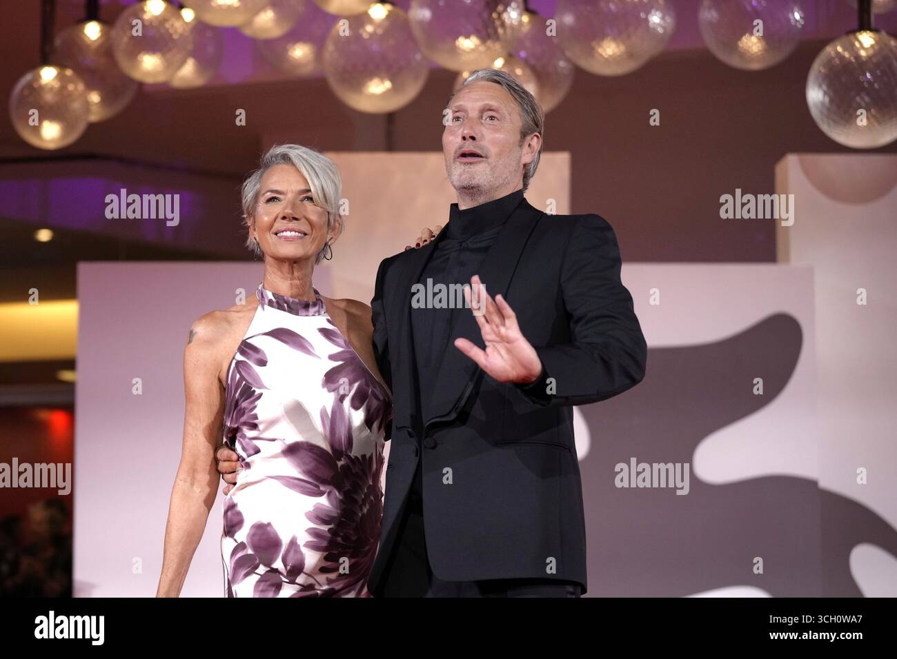 Hanne Jacobsen, left, and Mads Mikkelsen pose for photographers at the ...