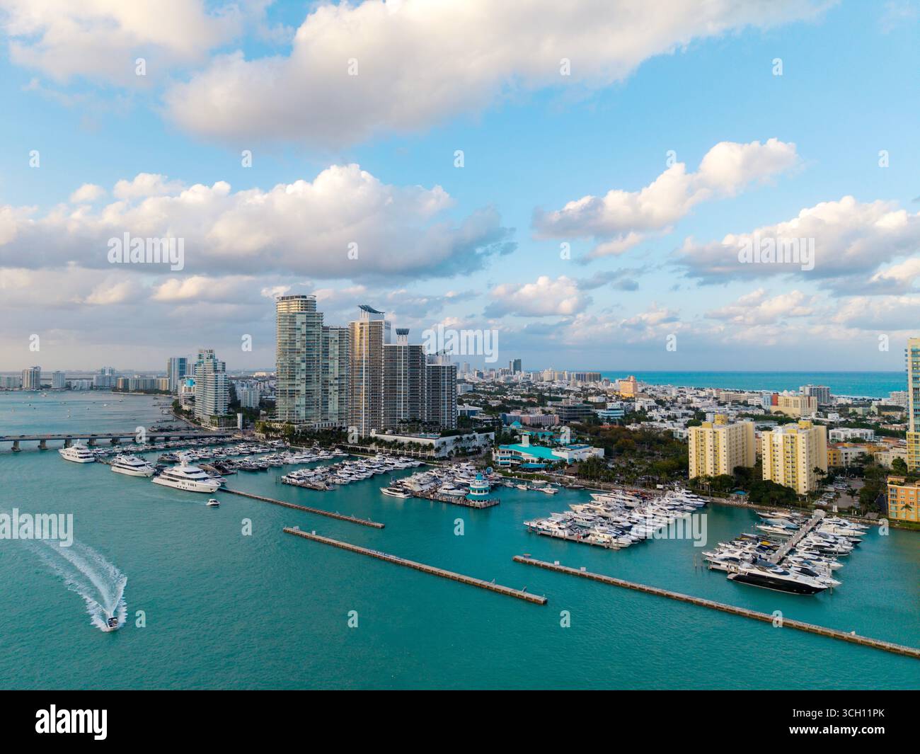 Marina Bay filled with vessels and yacht in Miami. Skyline with yachts ...