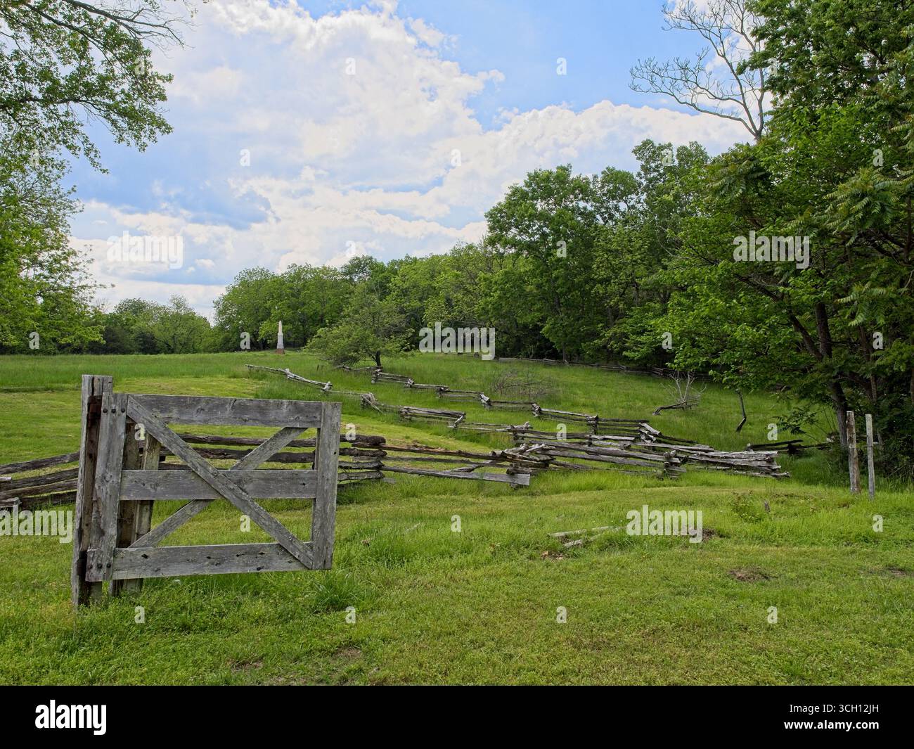 Old wooden gate, meandering split-rail fence, distant 1889 Reunited ...