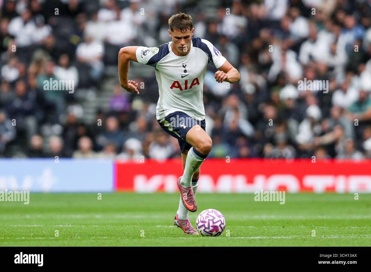Rodrigo Bentancur of Tottenham Hotspur runs with the ball during the ...