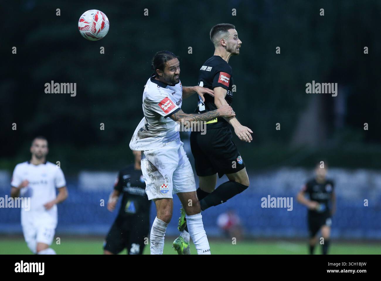 Leonard Zuta of Slaven Belupo and Kristijan Pavicic of Vukovar fight ...