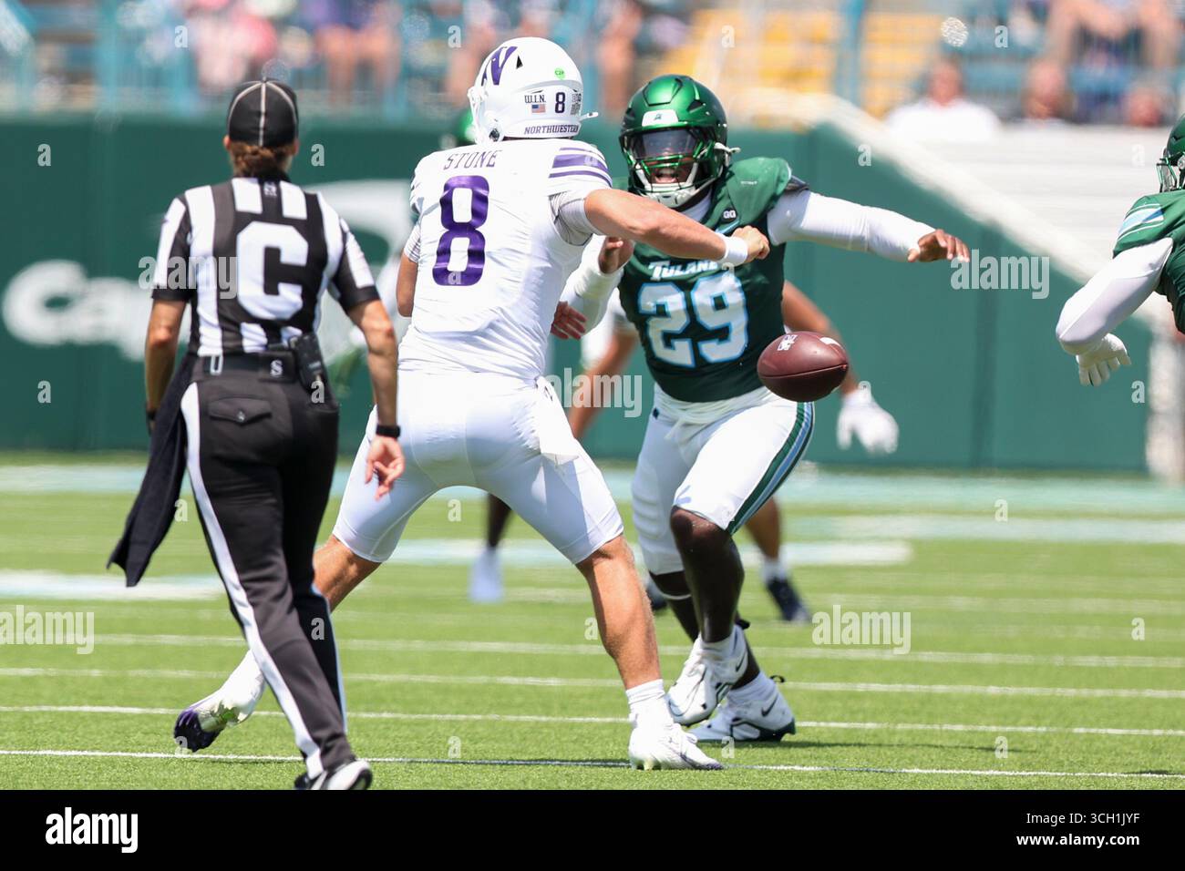 The ball slips out of Northwestern Wildcats quarterback Preston Stone’s ...