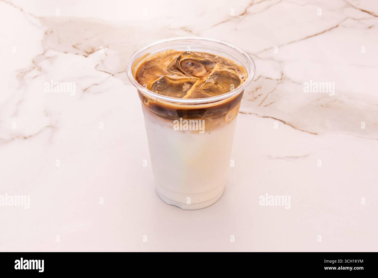 Cold Art: Ice Café Latte. Garnished with a touch of caramel or ...