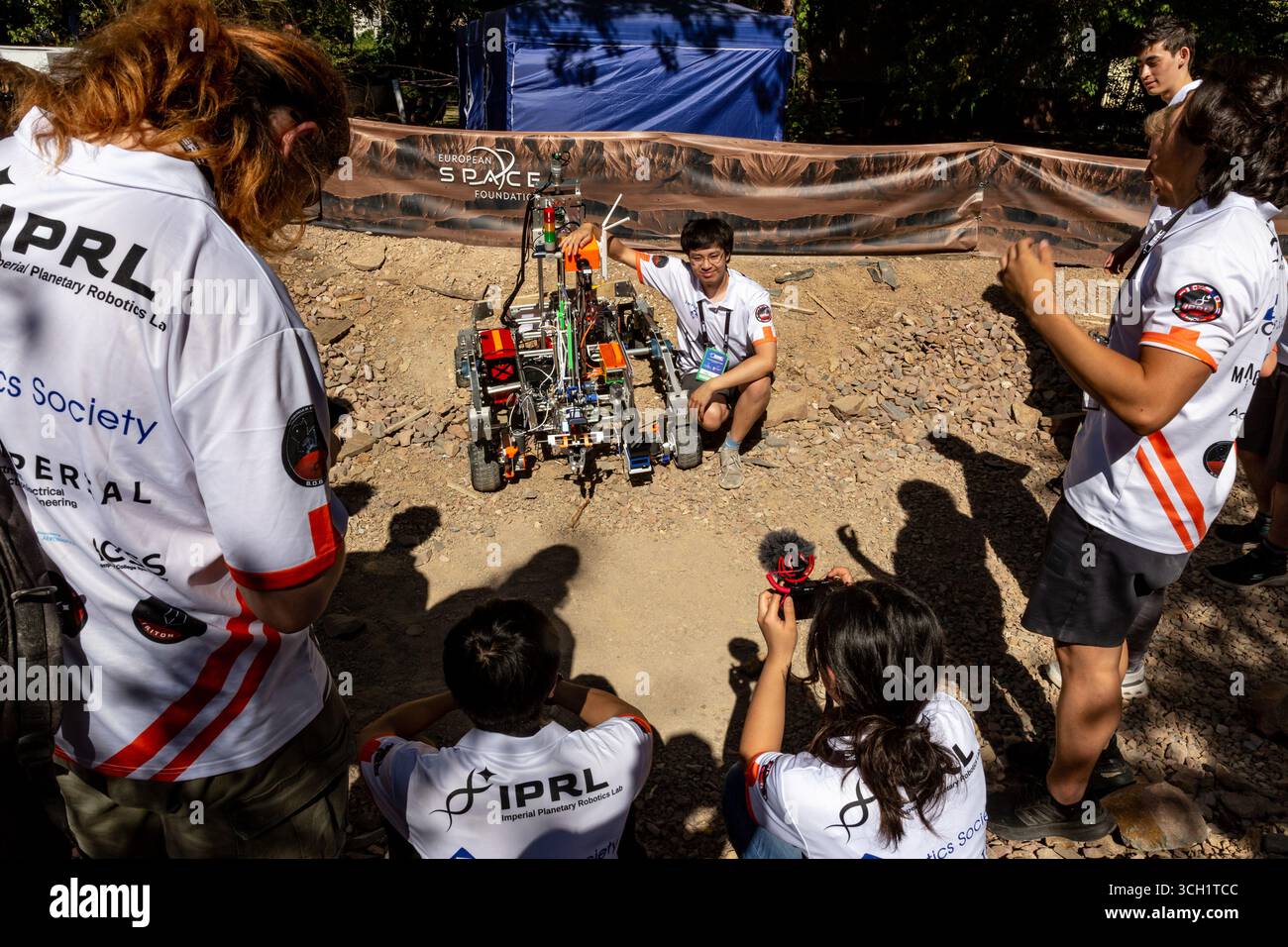 Students from the Imperial College London take pictures with their ...
