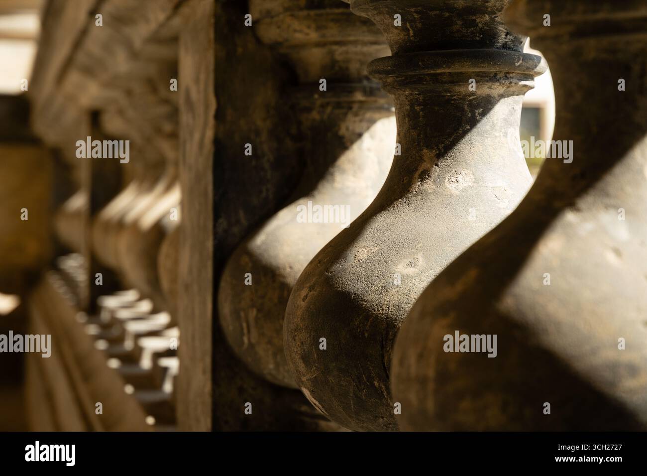 Baroque stone balusters with strong shadows on a historic balustrade ...