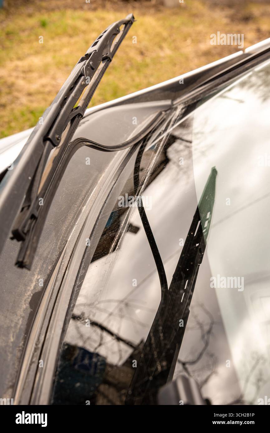 Close-up of a worn and cracked windshield wiper blade showing signs of ...