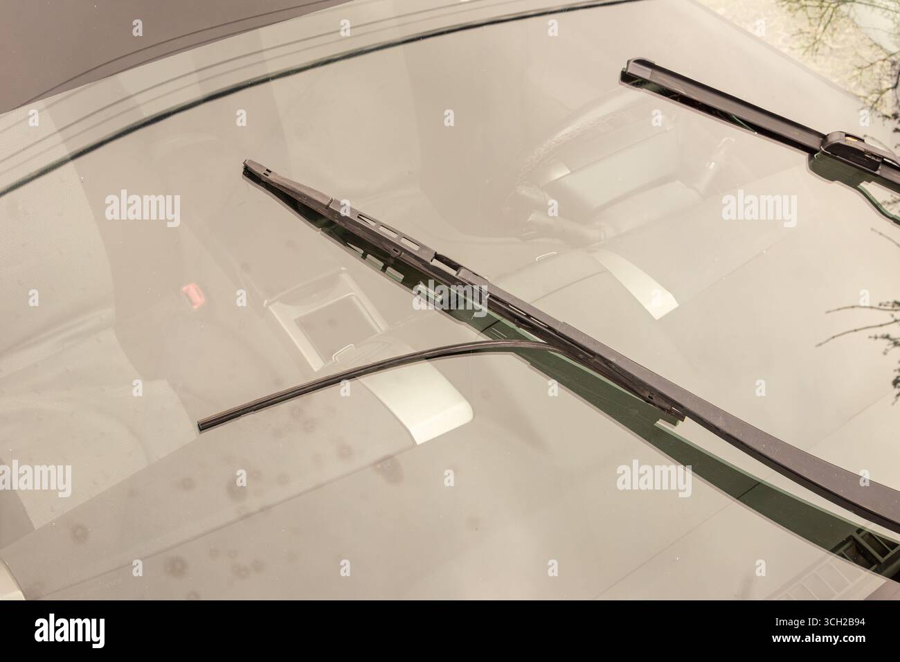 a torn wiper blade will smear dirt on the car glass, selective focus ...