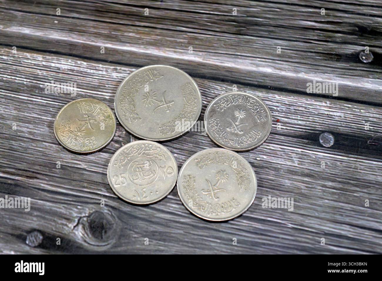 Multiple Saudi Arabian coins of different values, vintage retro, Riyals ...