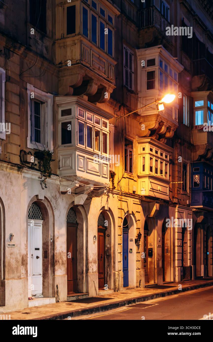 Valletta, Malta – April 9, 2025: Night street view with glowing ...