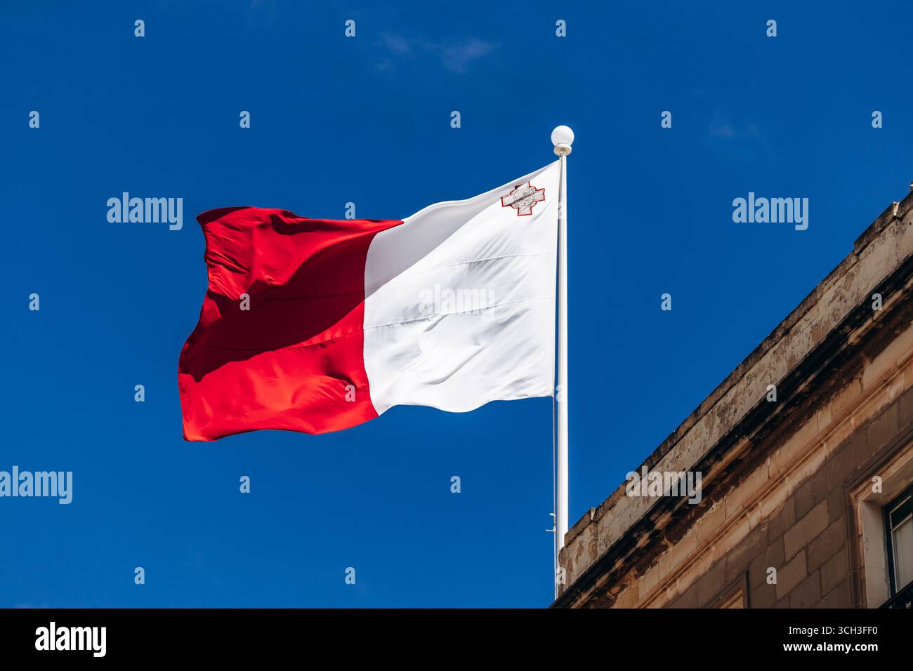 The national flag of Malta, red and white with the George Cross in the ...