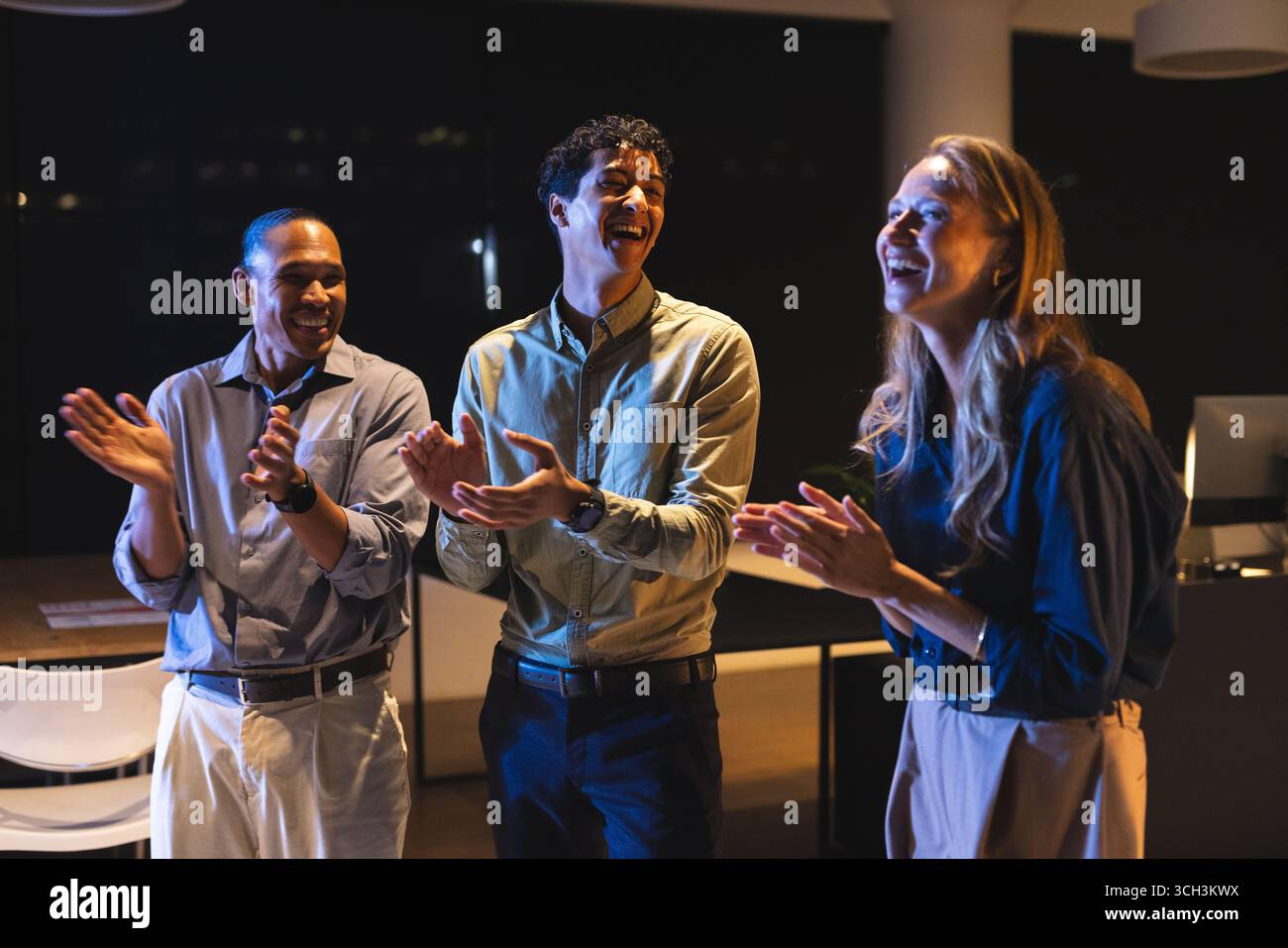 In office, business diverse professionals clapping and laughing during ...