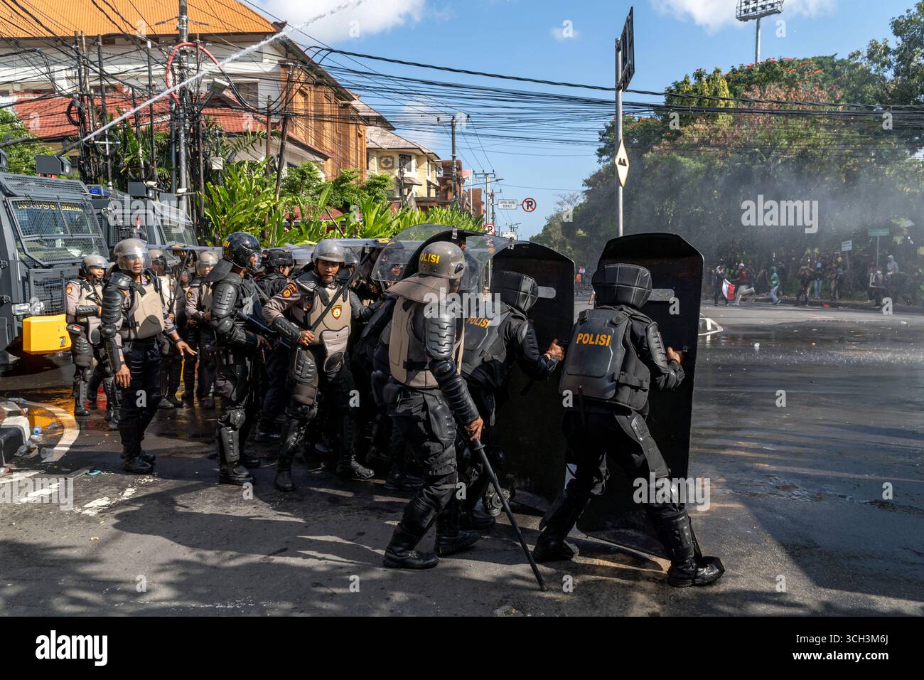 Police officers set up defensive formations during a protest. Massive ...