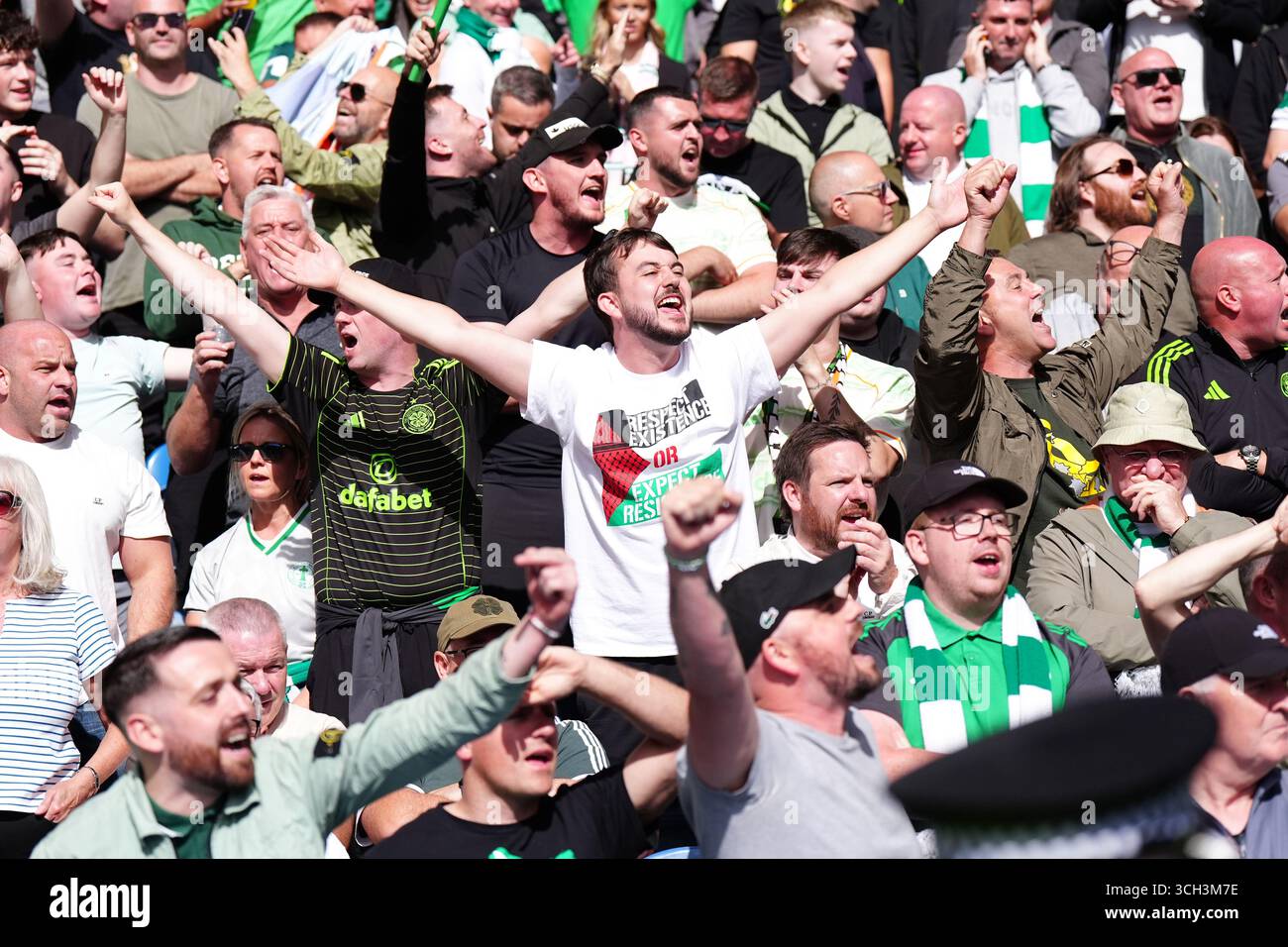 A fan wearing a t-shirt with the text 'Respect Existence or Expect ...