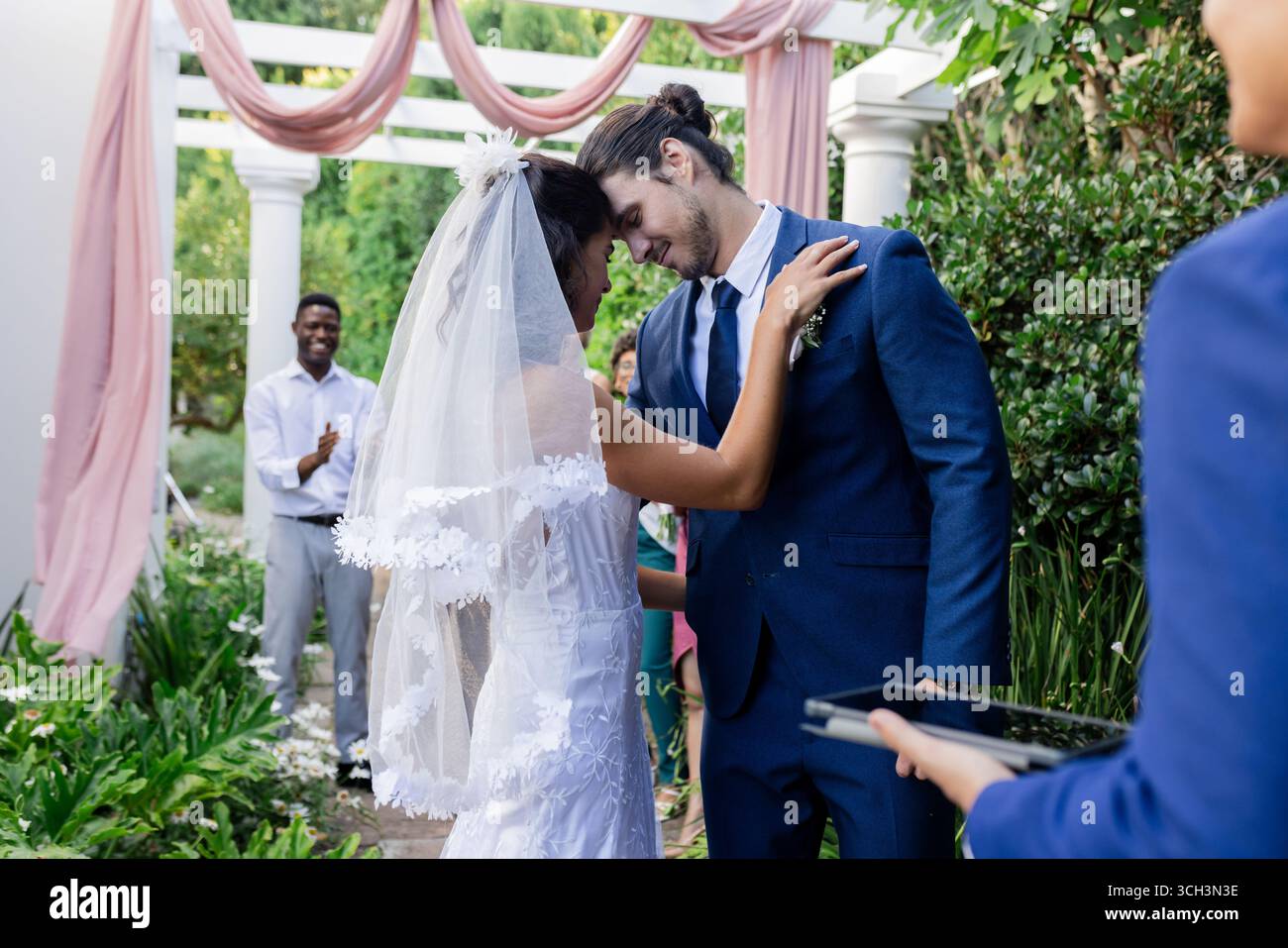 Bride and groom embracing outdoors, celebrating wedding with joyful ...