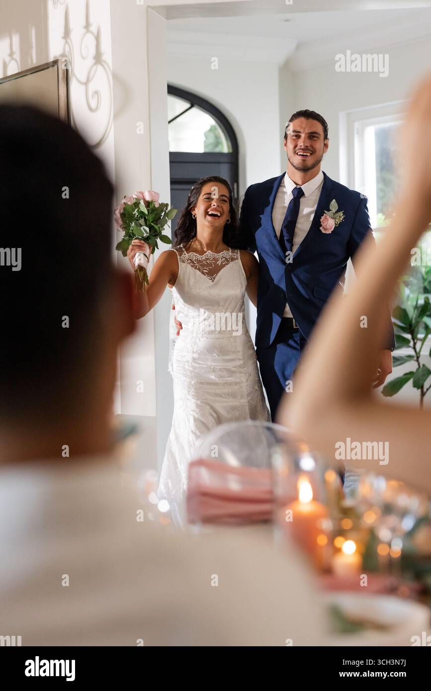 Diverse couple friends entering hi-res stock photography and images - Alamy