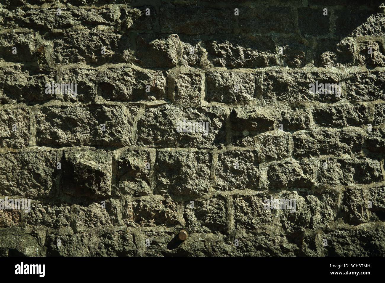 Granite stone masonry wall surface texture Stock Photo - Alamy