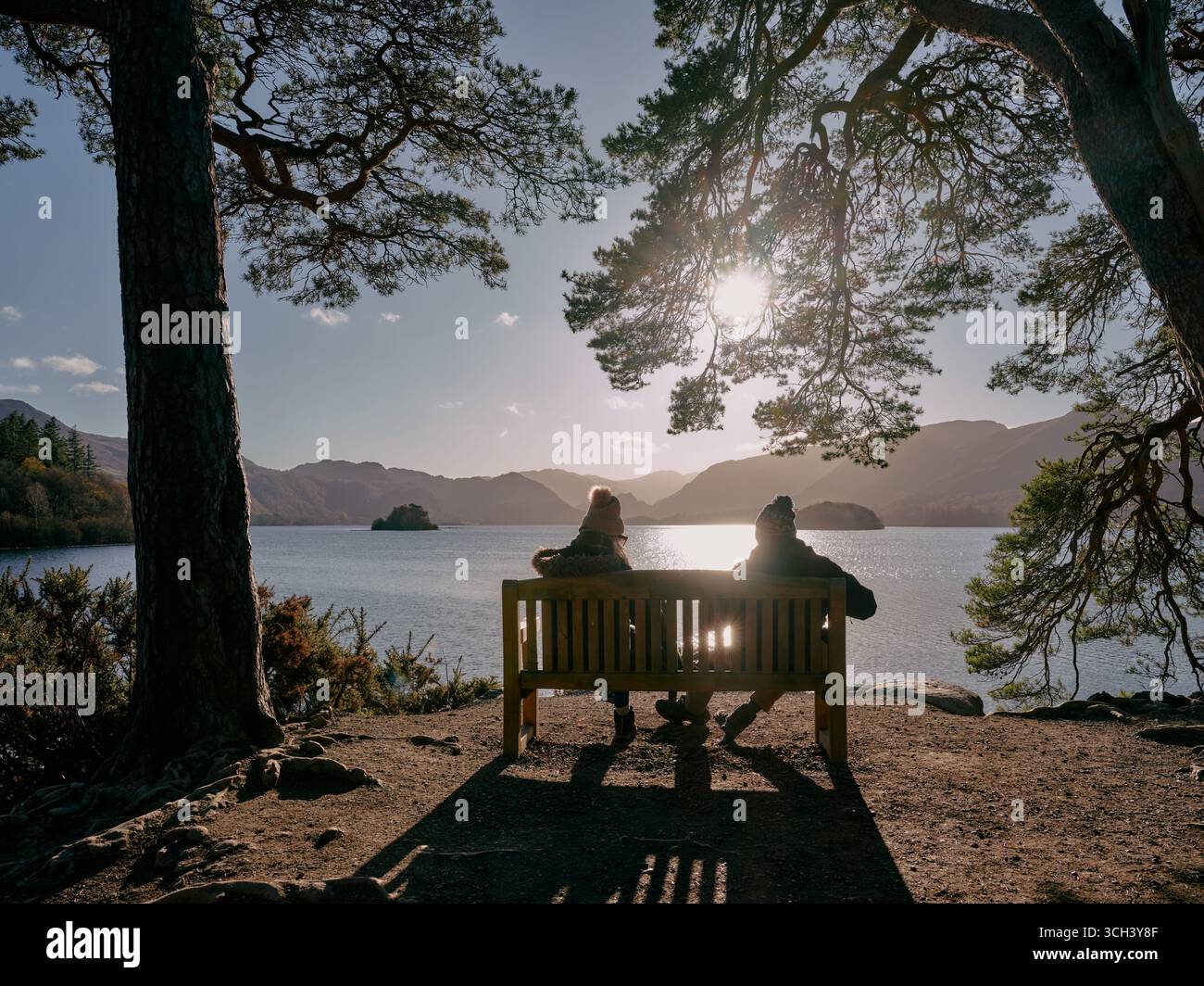 Tourist couple enjoying the viewpoint at Friars' Crag / Cragg or Friars ...