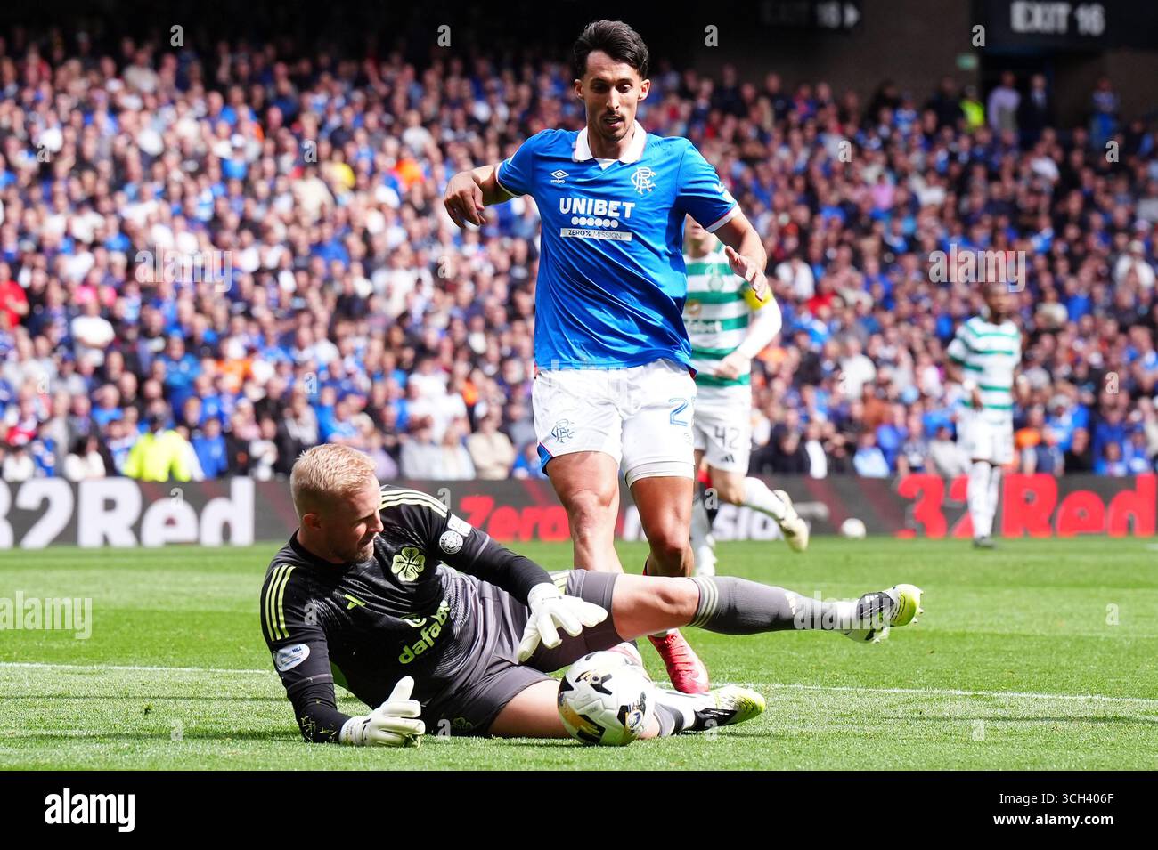 Celtic goalkeeper Kasper Schmeichel claims the ball from Rangers' Bojan ...
