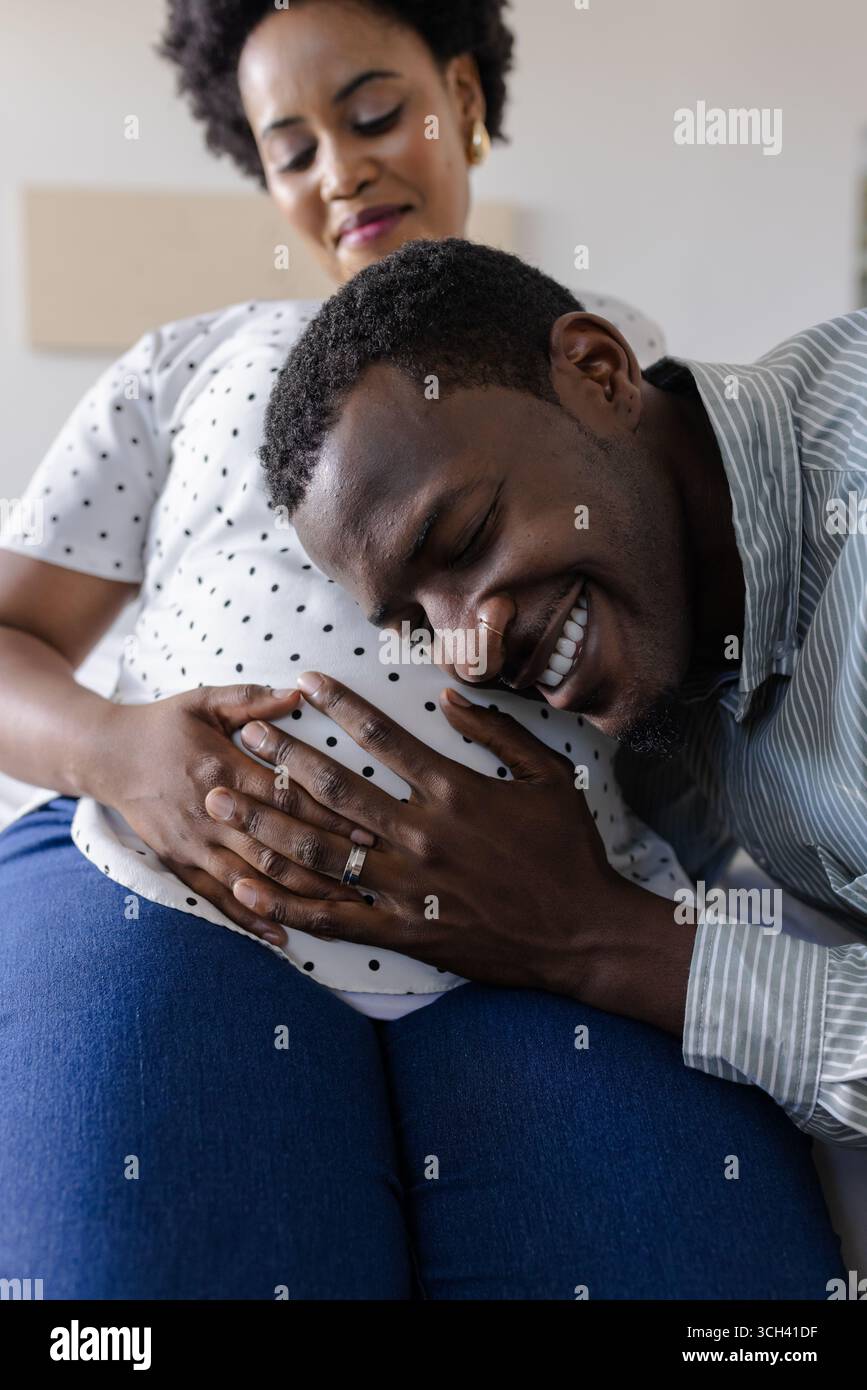 Pregnant couple new father listening hi-res stock photography and ...