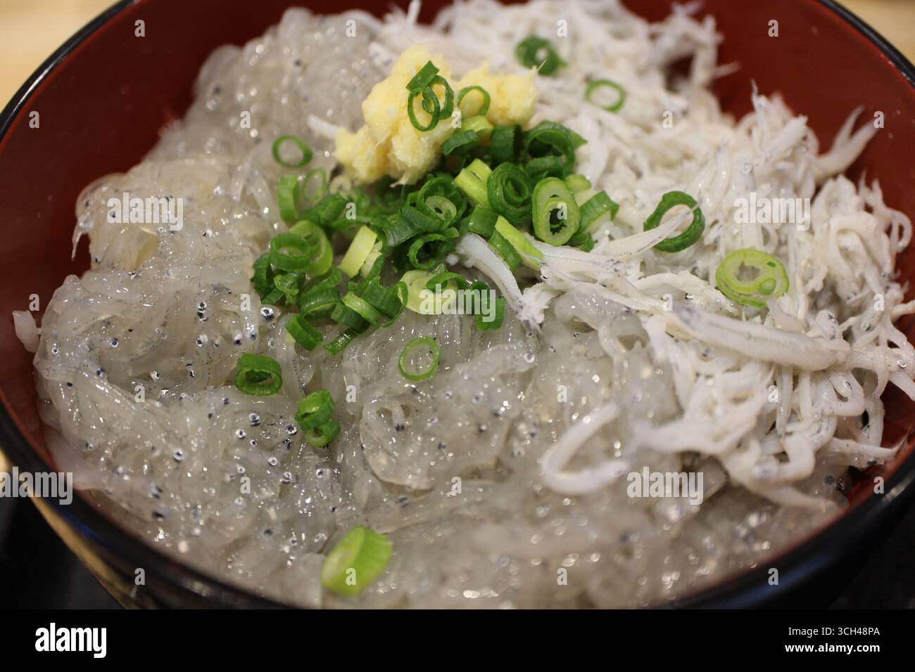 Japanese cuisine: raw whitebait and boiled whitebait rice bowl in ...