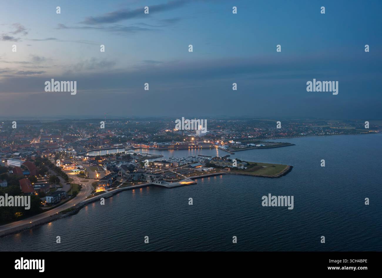 Aerial skyline cityscape of Thisted, Denmark at night, showing the ...