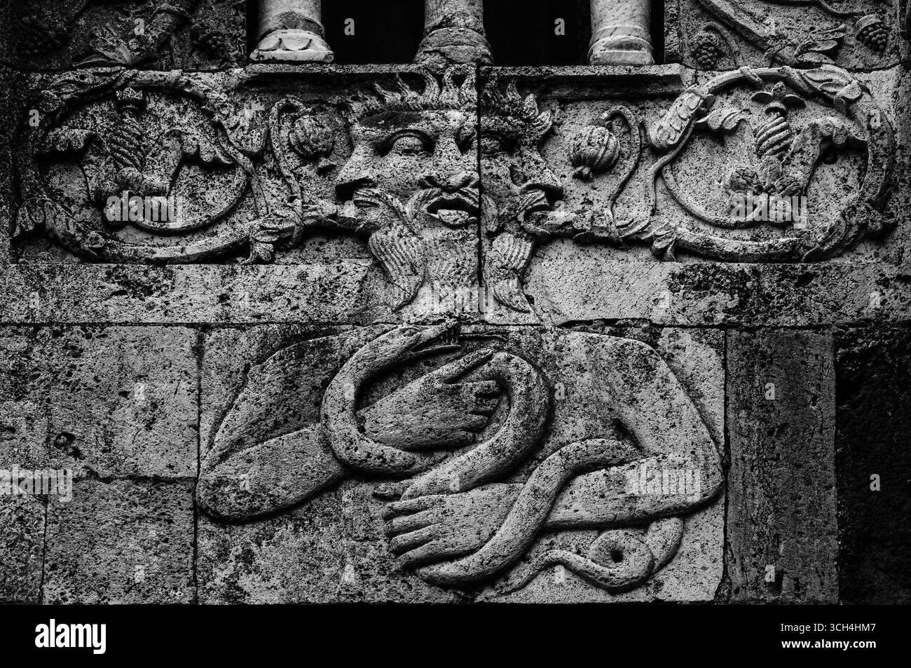 Three faces, three beards, flaming hair and a venomous snake: monstrous ...