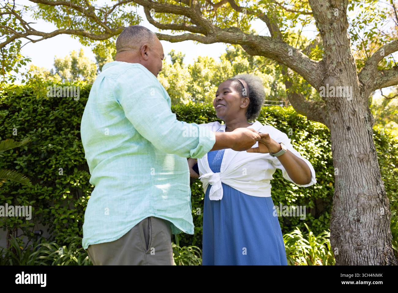 Couple dancing joyfully under hi-res stock photography and images - Alamy