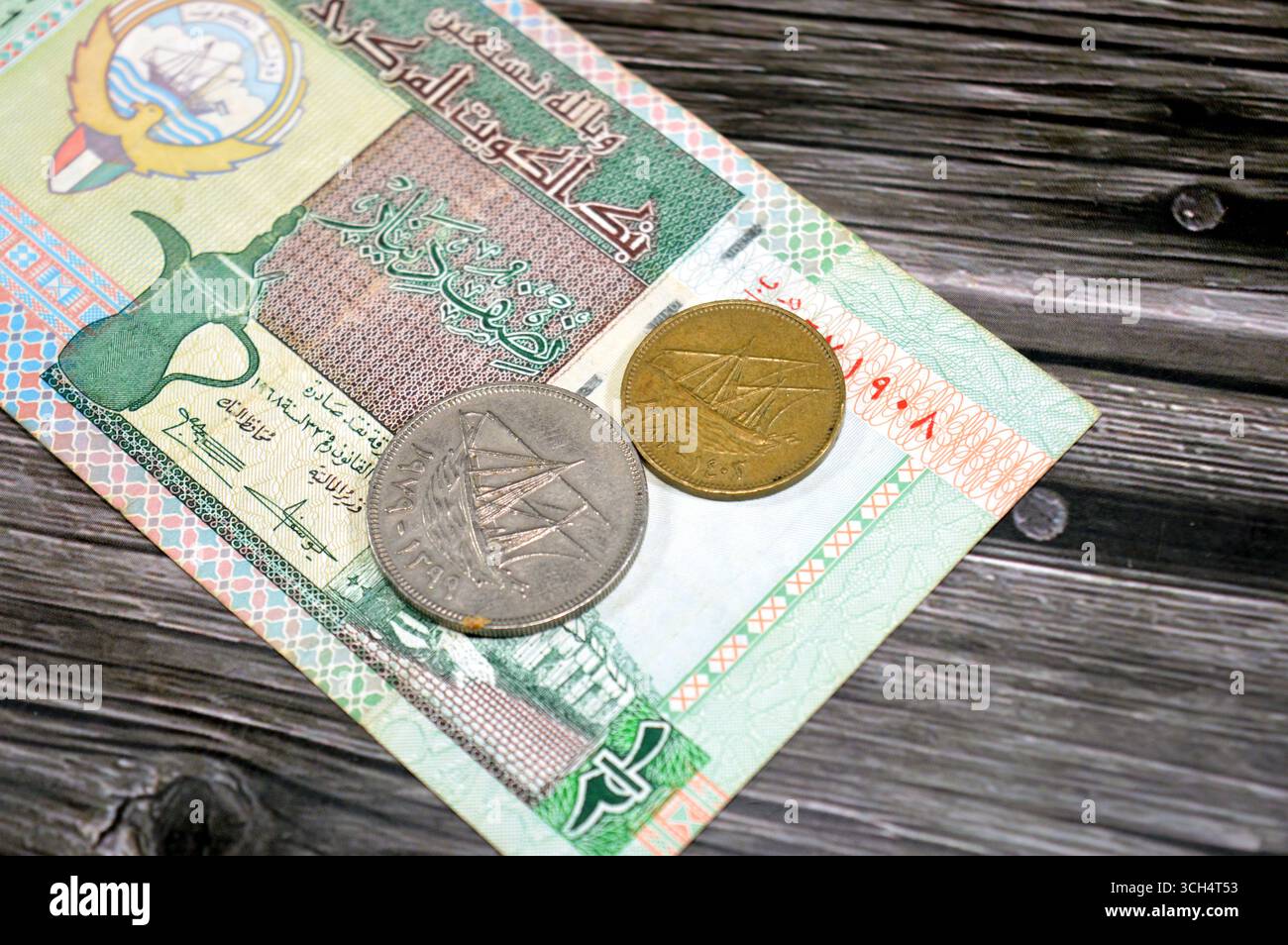 Kuwaiti old coins on Kuwaiti half dinar features coat of arms of Kuwait ...