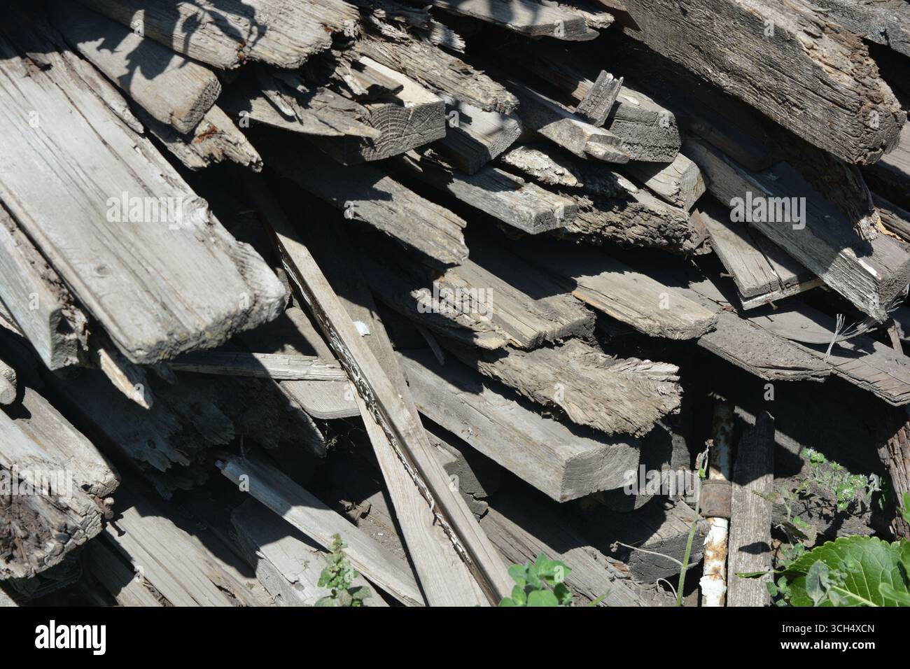 Old things and objects, old grey rotten boards of different sizes are ...